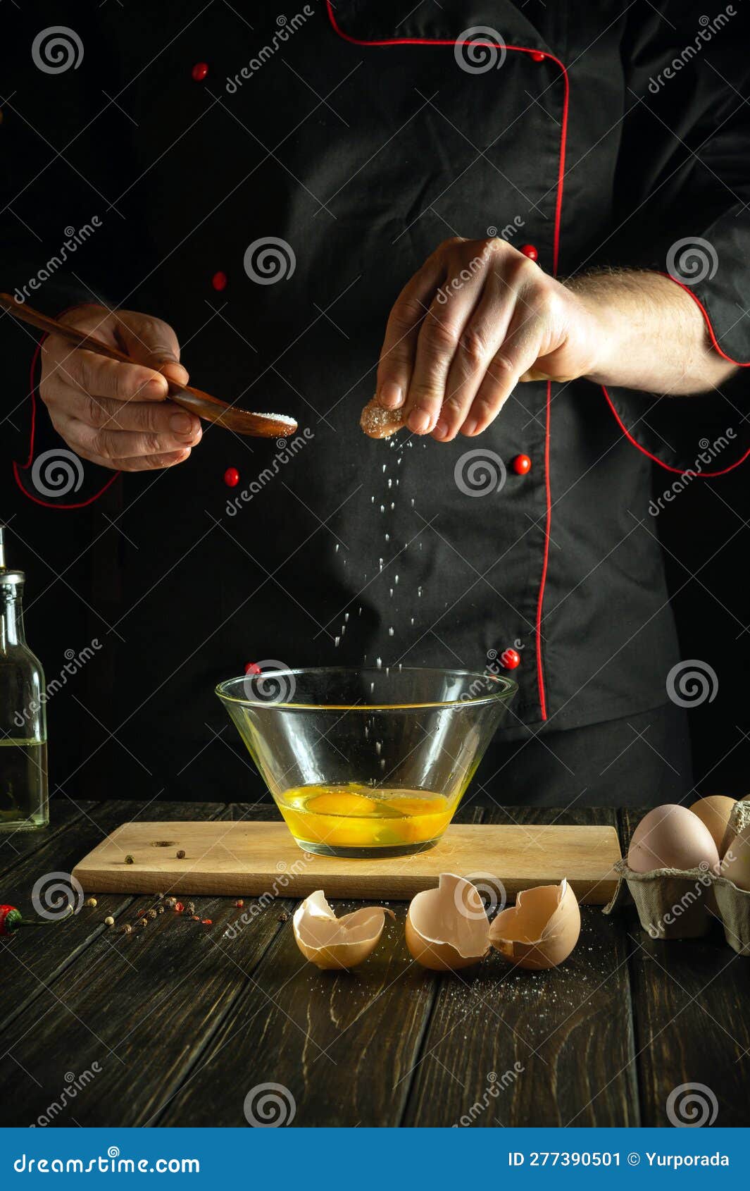 Professional Chef Adds Salt while Cooking the Eggs. Work Environment on ...