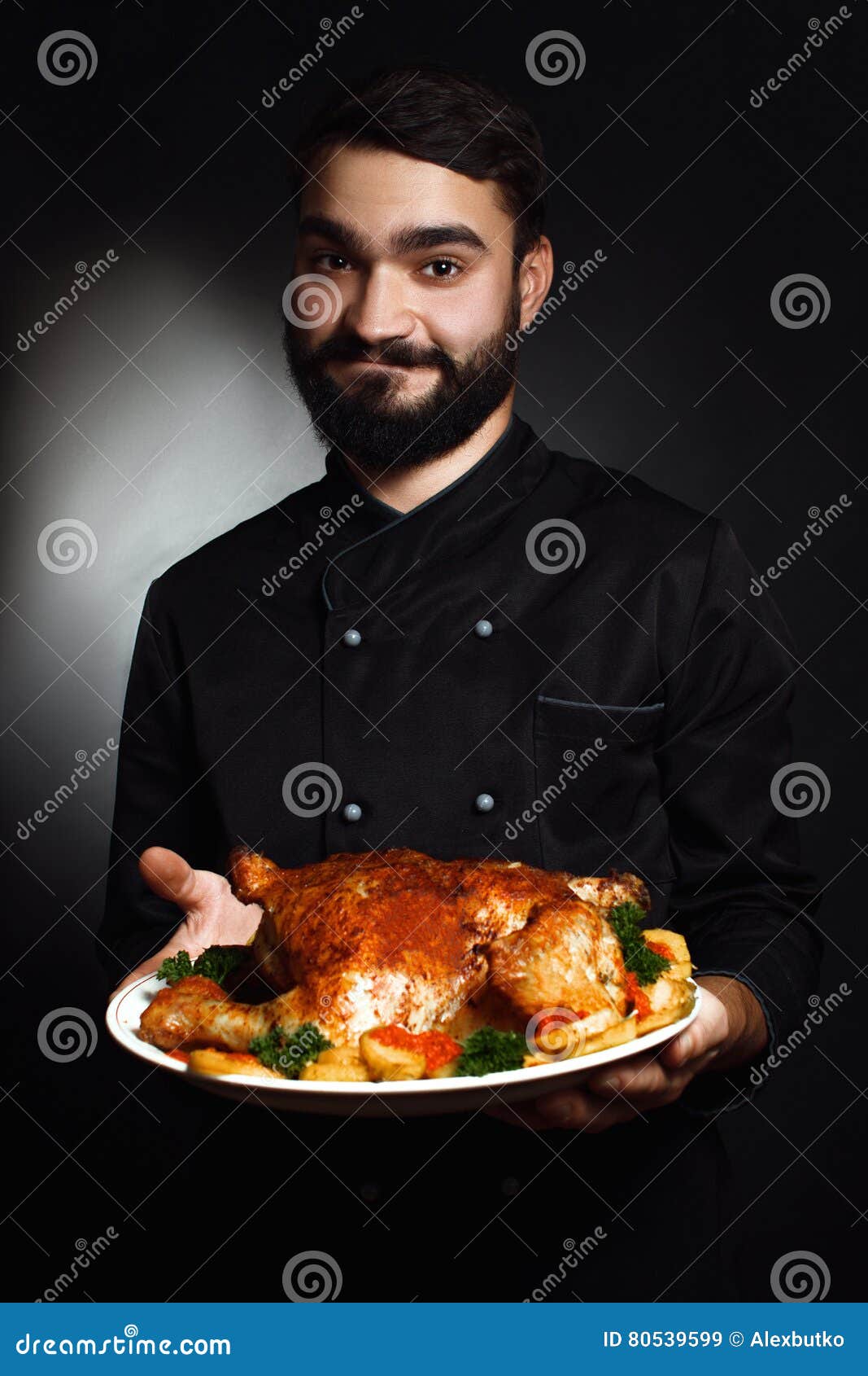 Professional Chef with a Beard in a Black Uniform with a Kitchen Knife ...