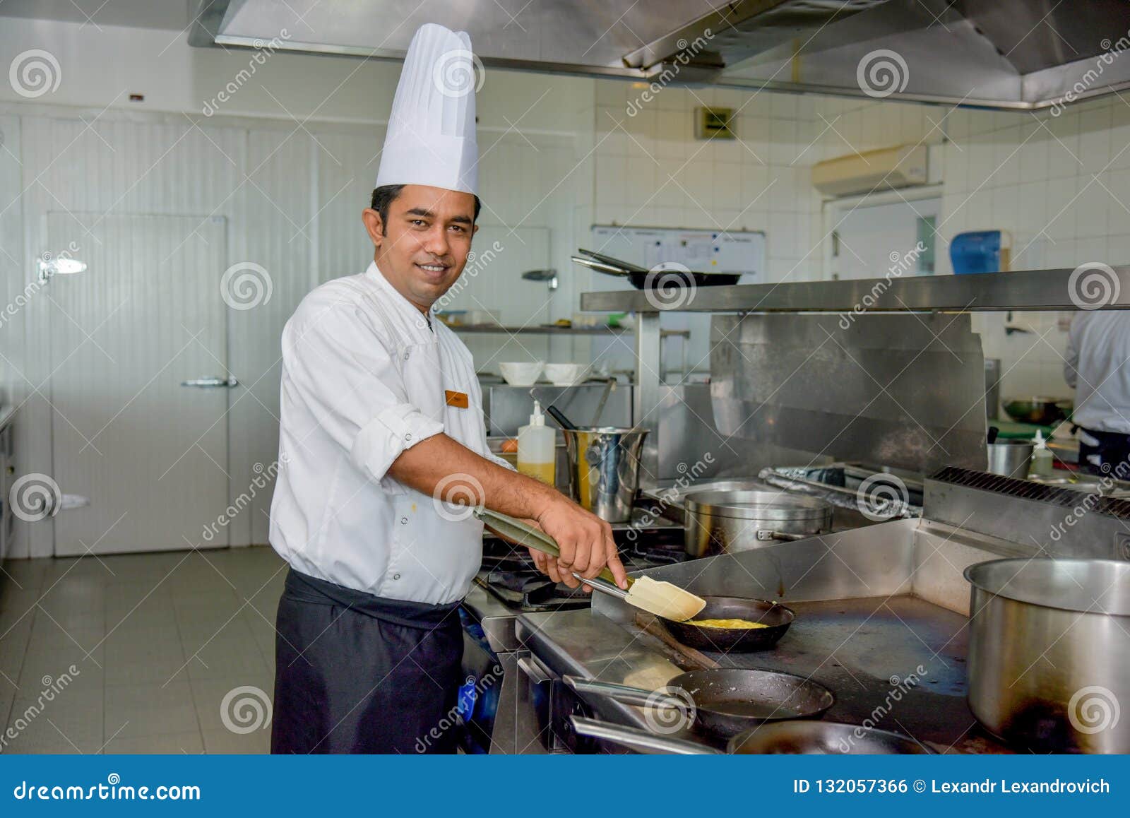 Professional Chef Cooking Omlet on the Skillet at the Kitchen and ...