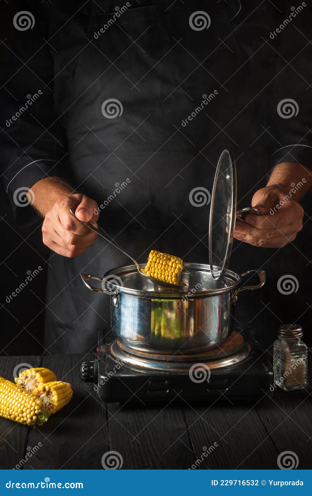 The Professional Chef Cooks Corn. Close-up of a Cook is a Hand while ...