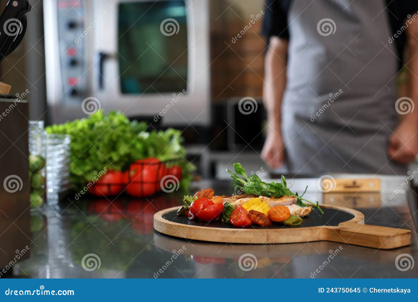 Professional Chef in Restaurant Kitchen, Focus on Table with Delicious ...