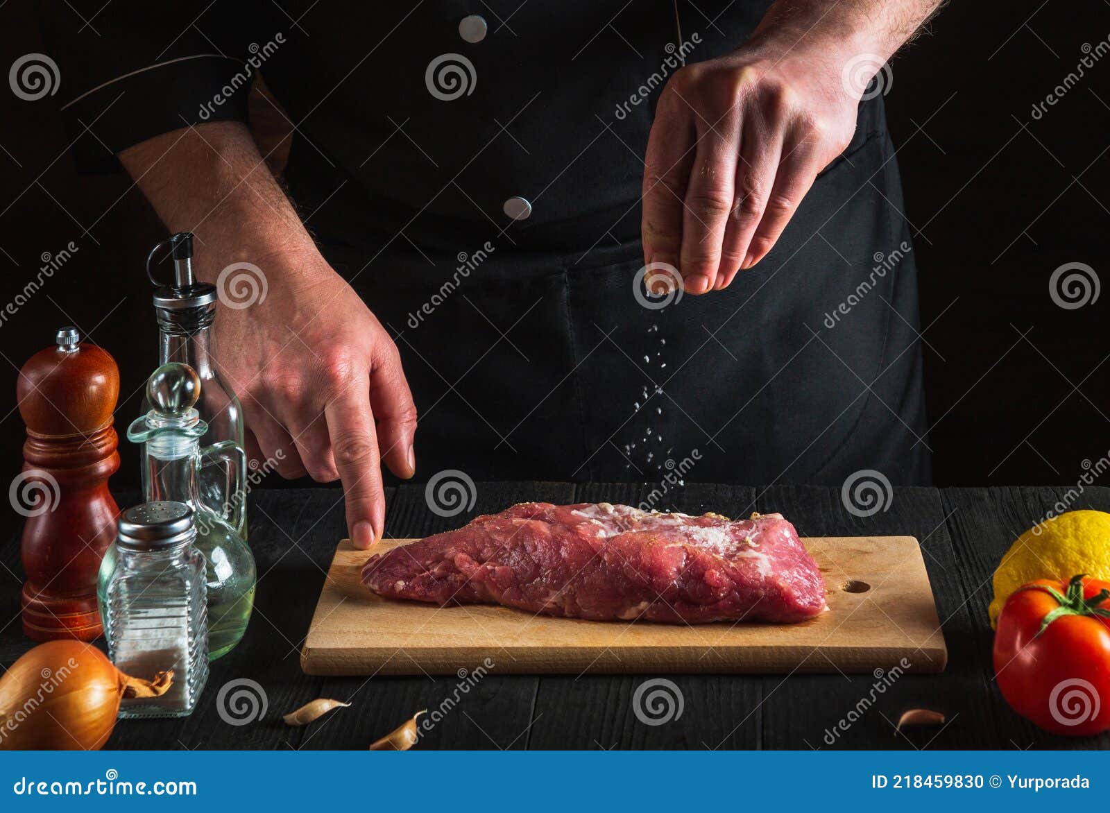Professional Chef Sprinkles the Raw Beef Meat with Salt. Preparing Meat ...