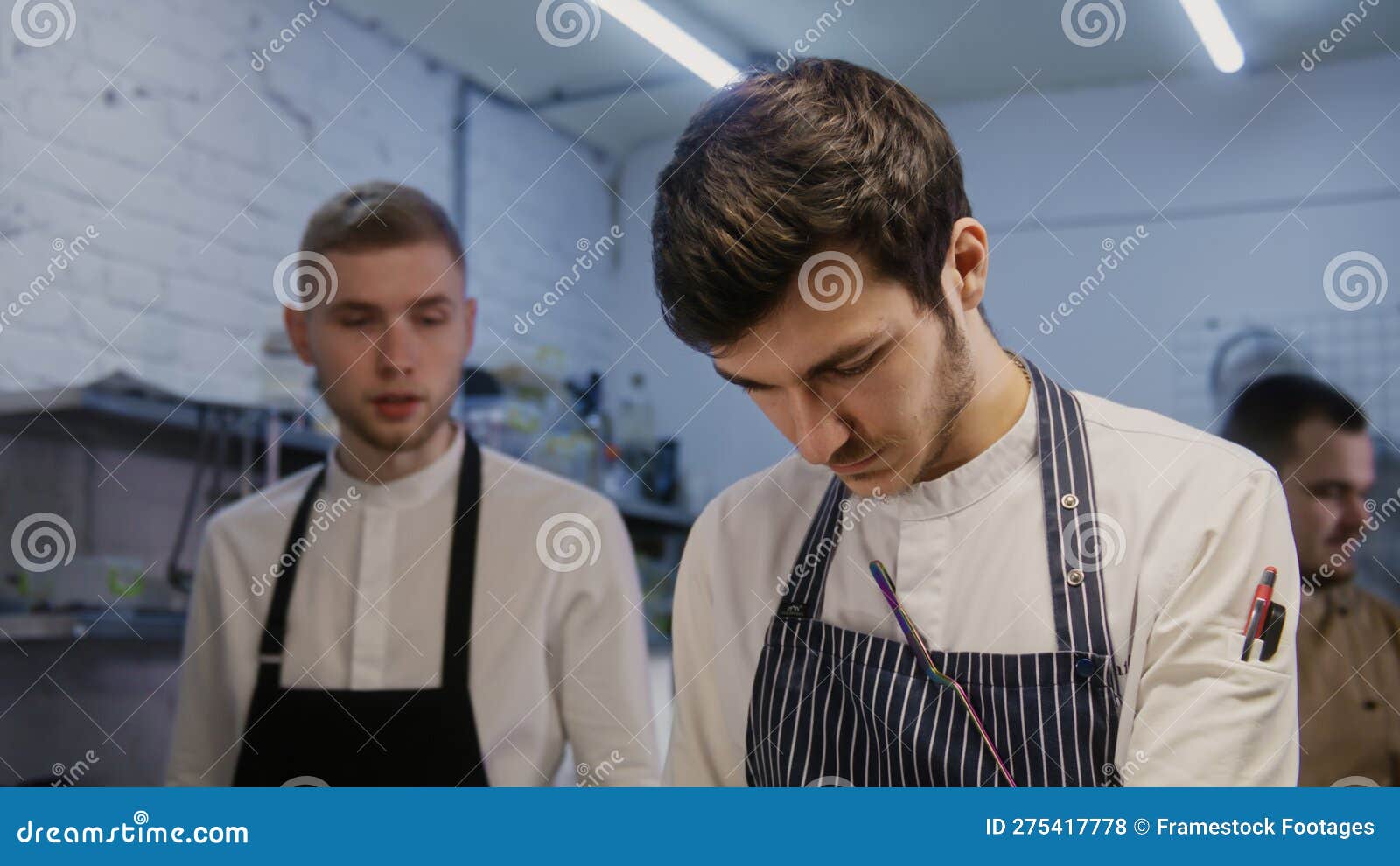 Professional Chef Stands by Kitchen Table and Making Food Stock Photo ...