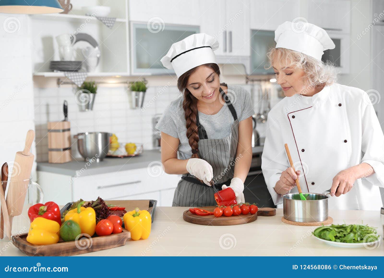 Professional Chef and Trainee Working Together Stock Photo - Image of ...