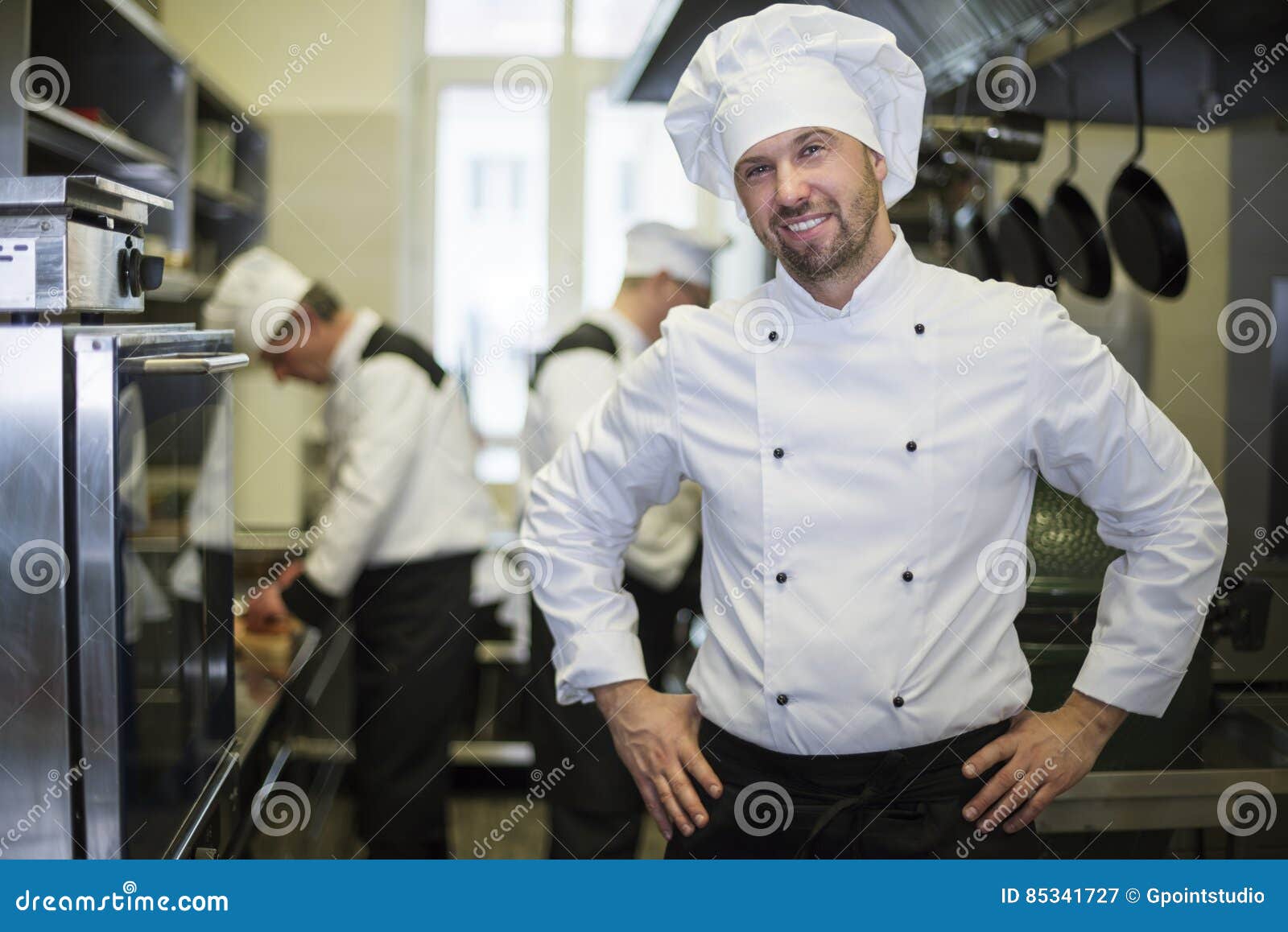 Professional chef at work stock image. Image of hips - 85341727