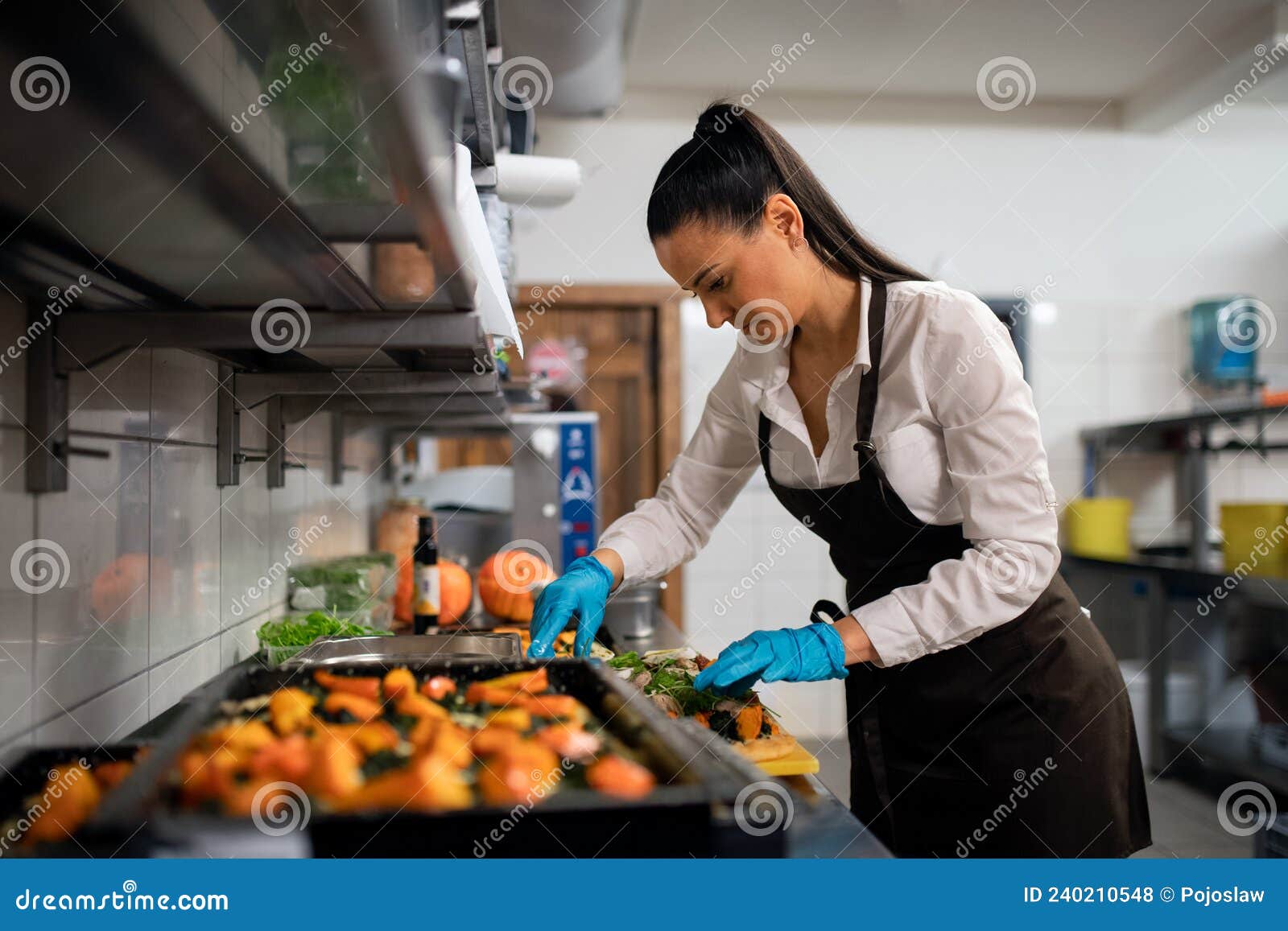 Professional Chef Working on Her Dishes Indoors in Restaurant Kitchen ...