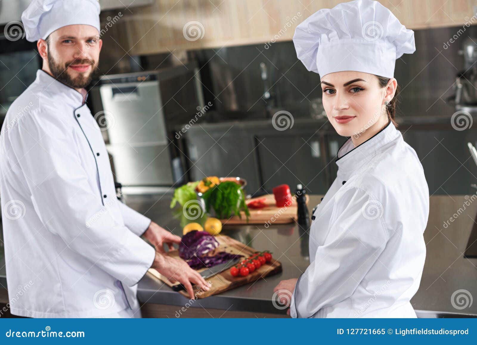 Professional Chefs Looking at Camera by Table Stock Image - Image of ...