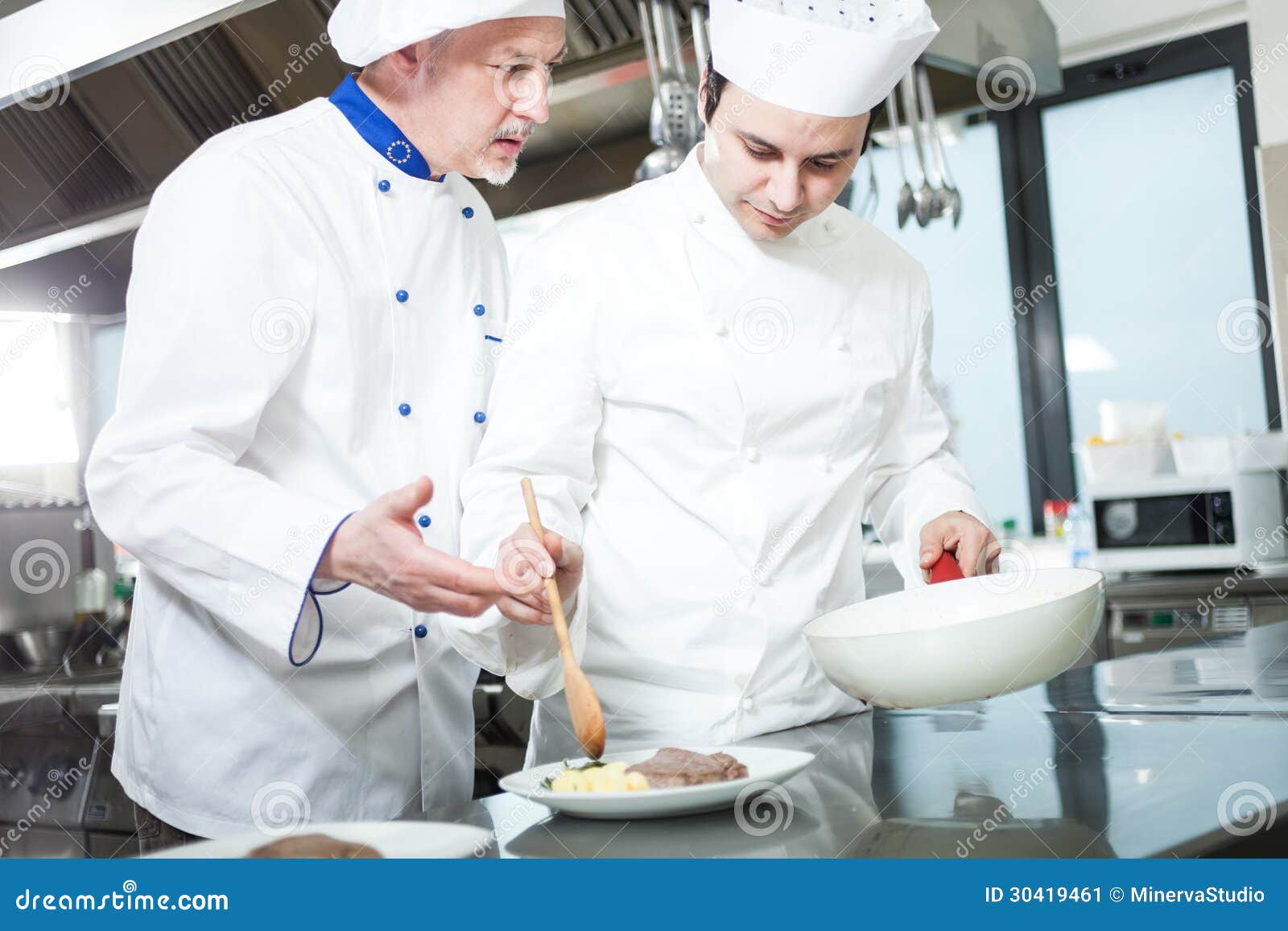 Professional chefs at work stock image. Image of light - 30419461
