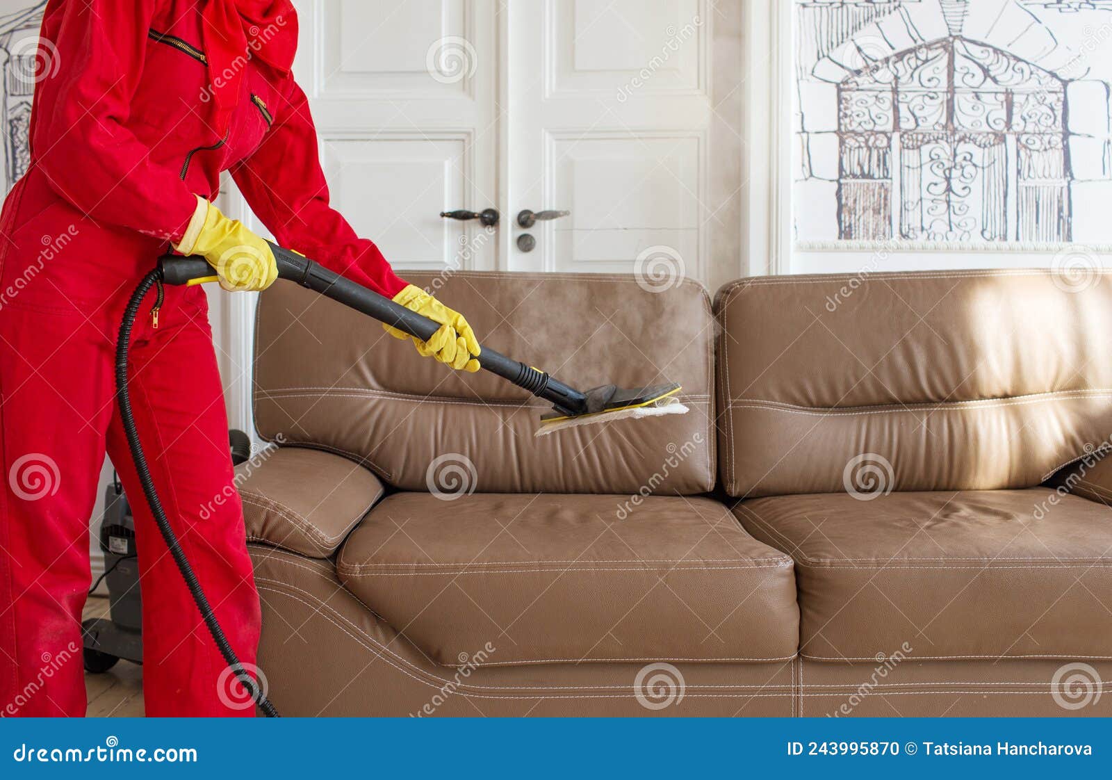 A Professional Cleaner in a Red Uniform at Her Work, with a Steam ...