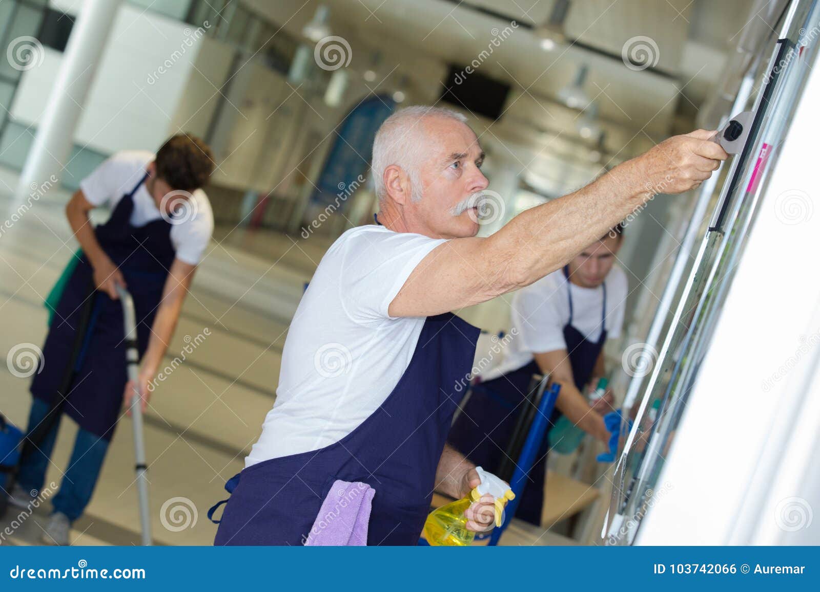 Professional Cleaners Team Working in Building Stock Photo - Image of ...
