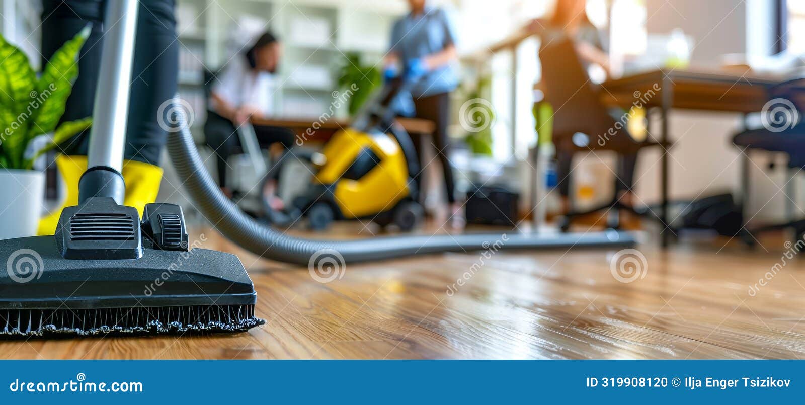 Professional Cleaning Crew Using Vacuum in Spacious Office with ...