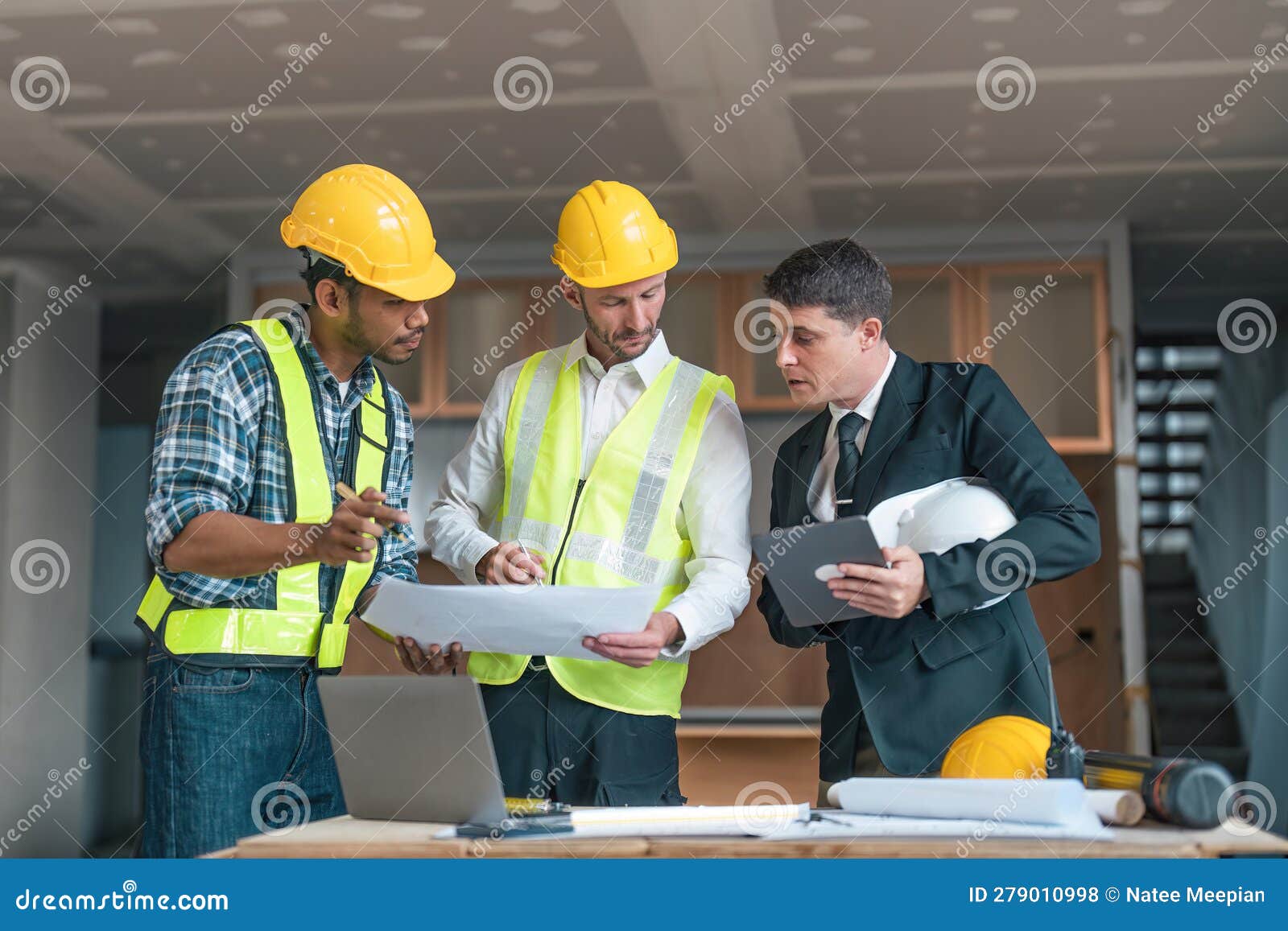 Professional Construction Engineers Team Using Blueprint of Project ...