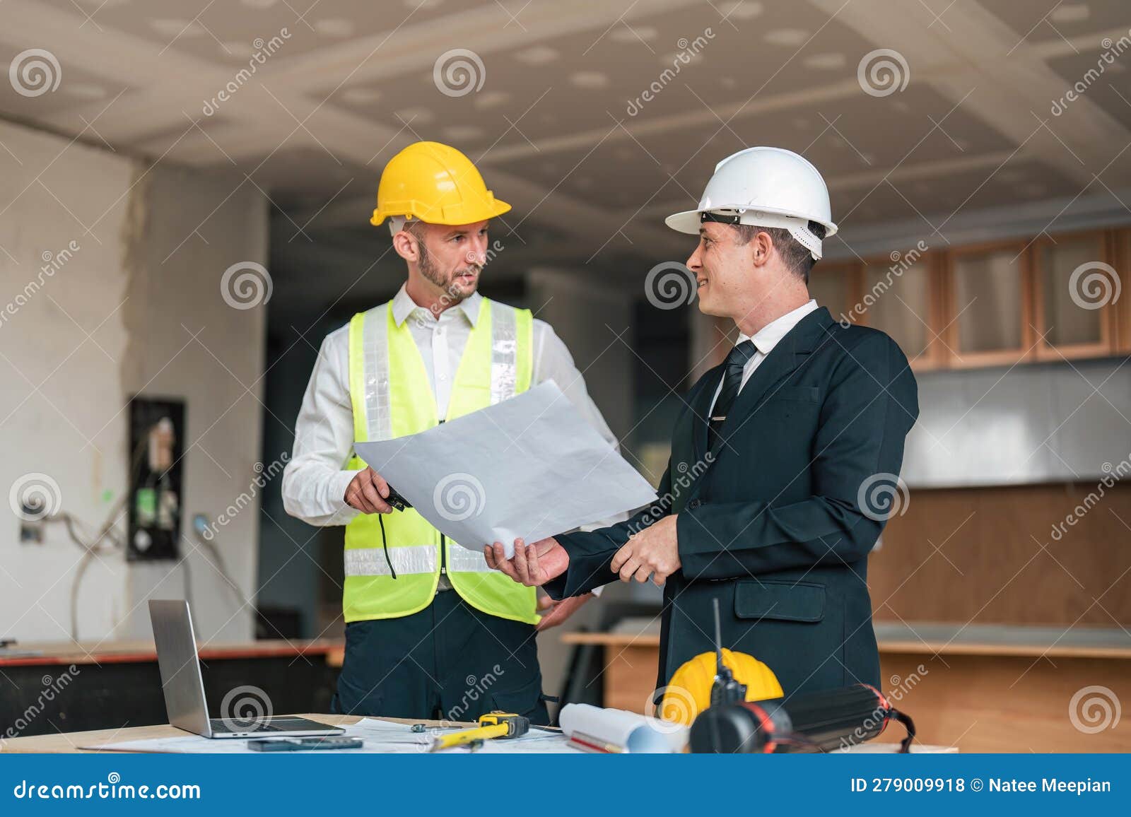 Professional Construction Engineers Team Using Blueprint of Project ...