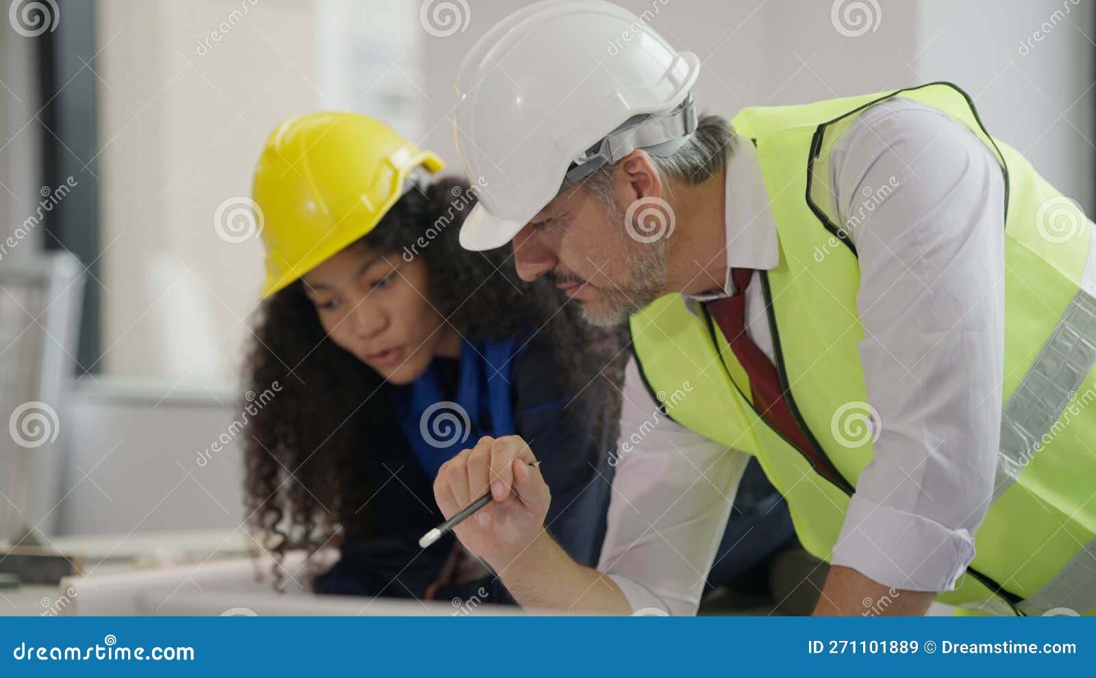 Professional Construction Engineers Team Using Blueprint of Project ...