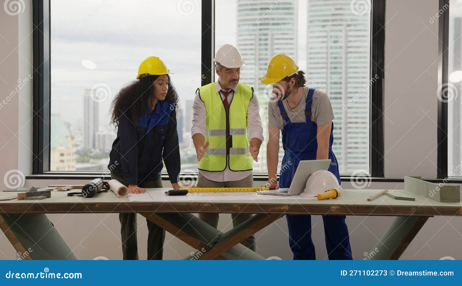 Professional Construction Engineers Team Using Blueprint of Project ...