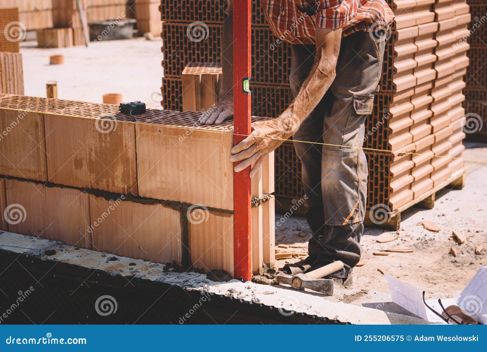 Professional Construction Worker Adjusting Bricks and Mortar - Building ...