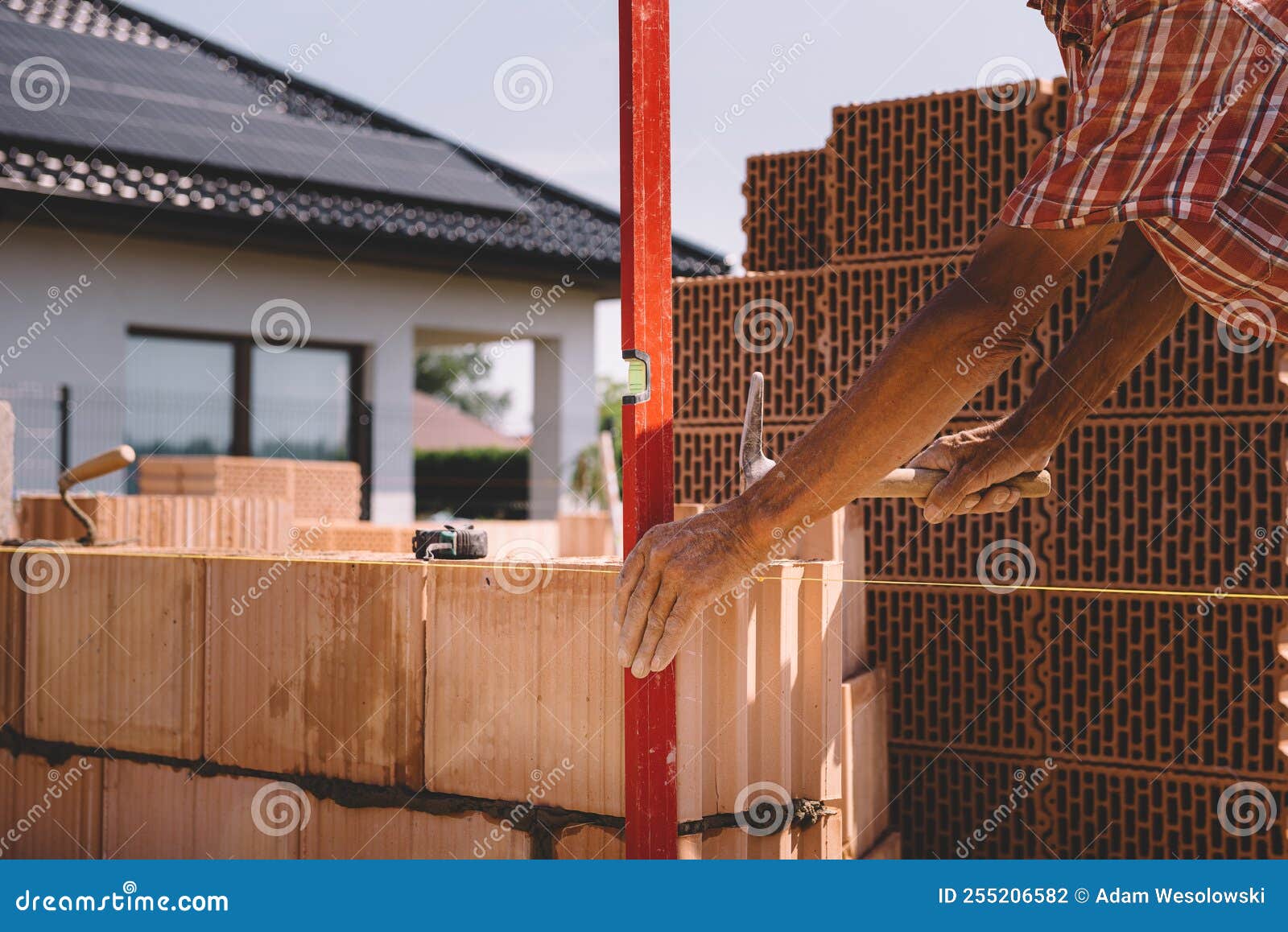 Professional Construction Worker Adjusting Bricks and Mortar - Building ...