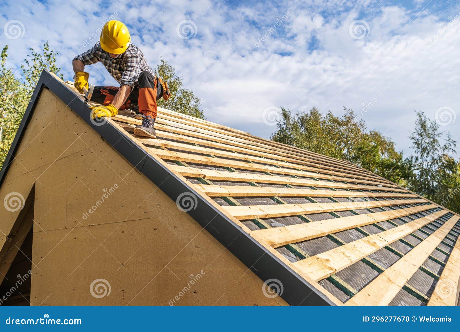 Assembling Roof To A House Under Construction By Installing Plywood On ...