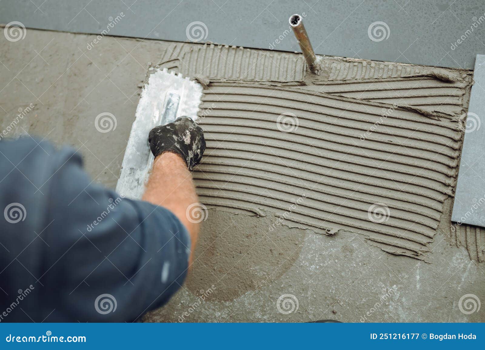 Professional Construction Worker Laying Adhesive and Placing Ceramic ...