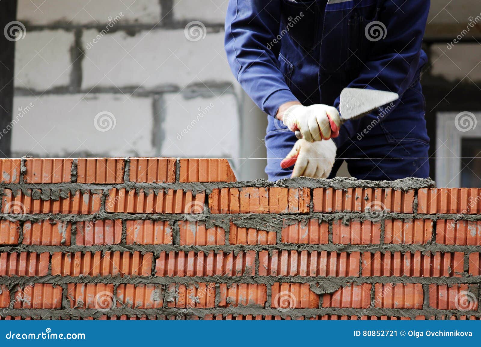 Professional Construction Worker Laying Bricks and Building House on ...