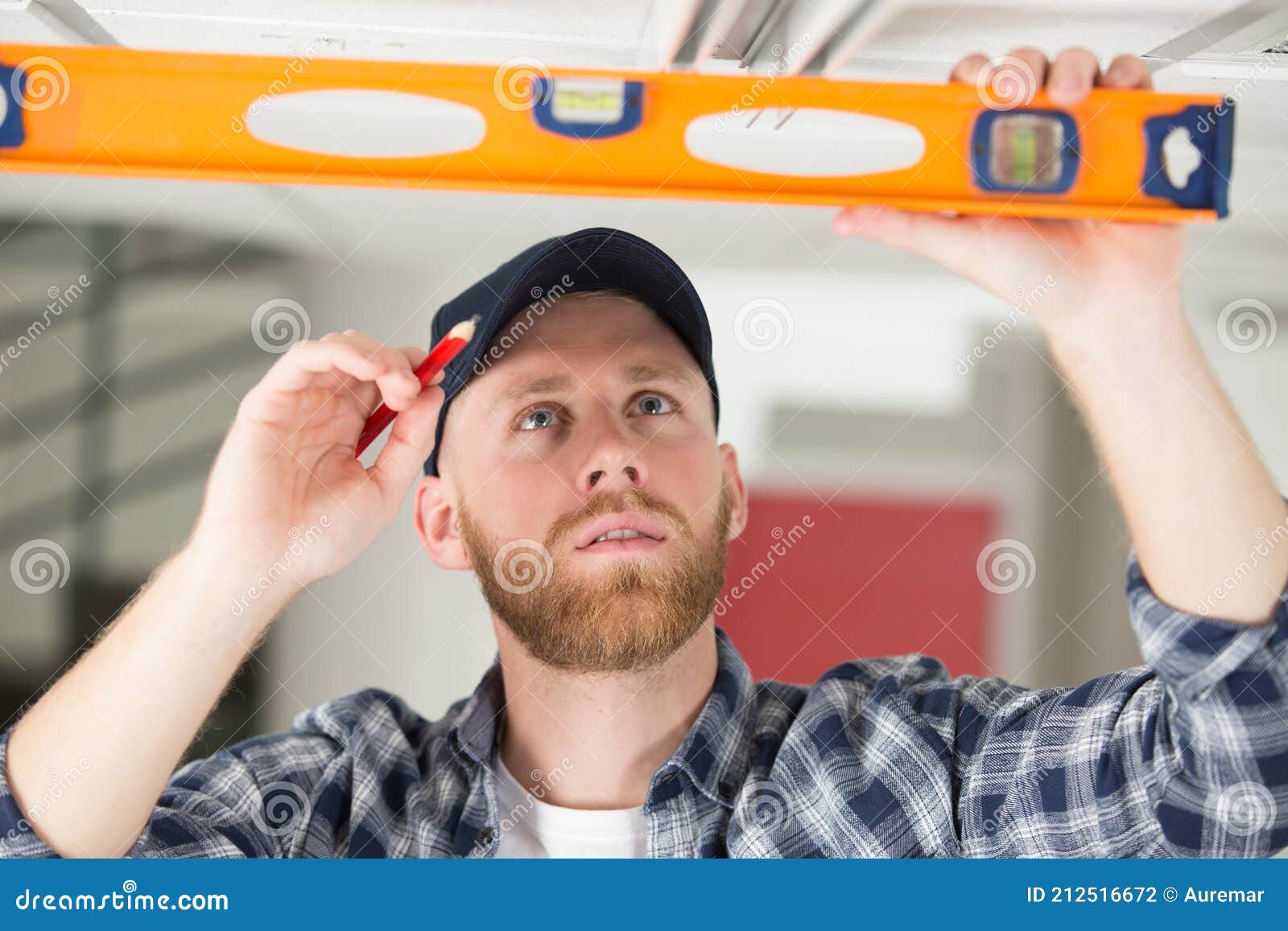 Professional Construction Worker Measuring Ceiling Stock Photo - Image ...