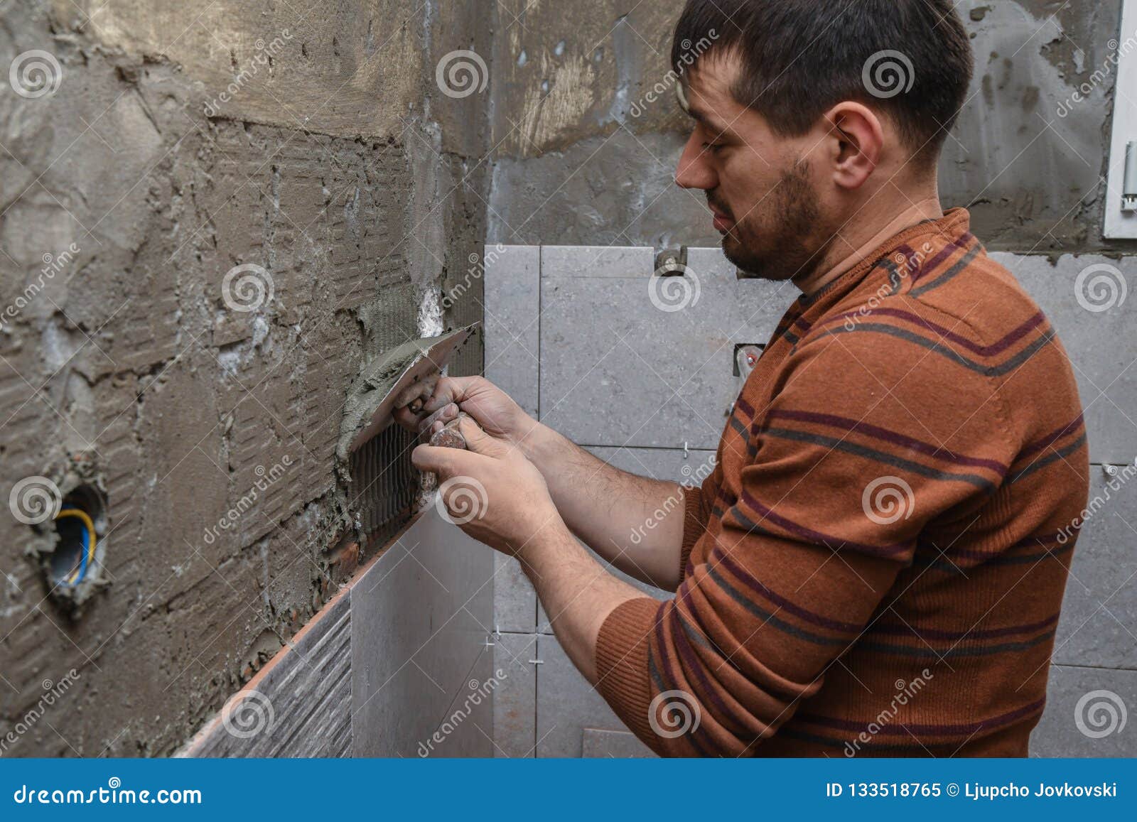 Professional Constructor Applying Glue on the Wall Stock Image - Image ...
