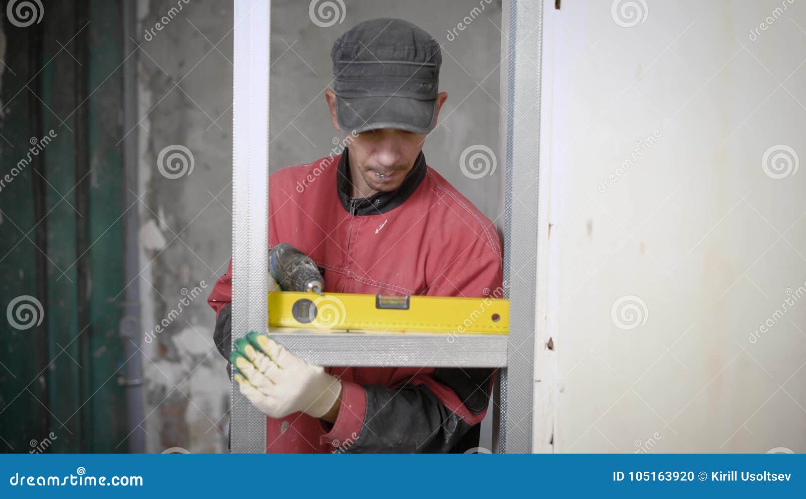 Professional Constructor Using Leveling Gauge for Measuring on Building ...