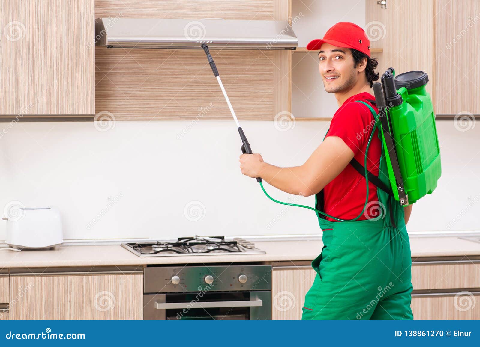 The Professional Contractor Doing Pest Control at Kitchen Stock Photo ...