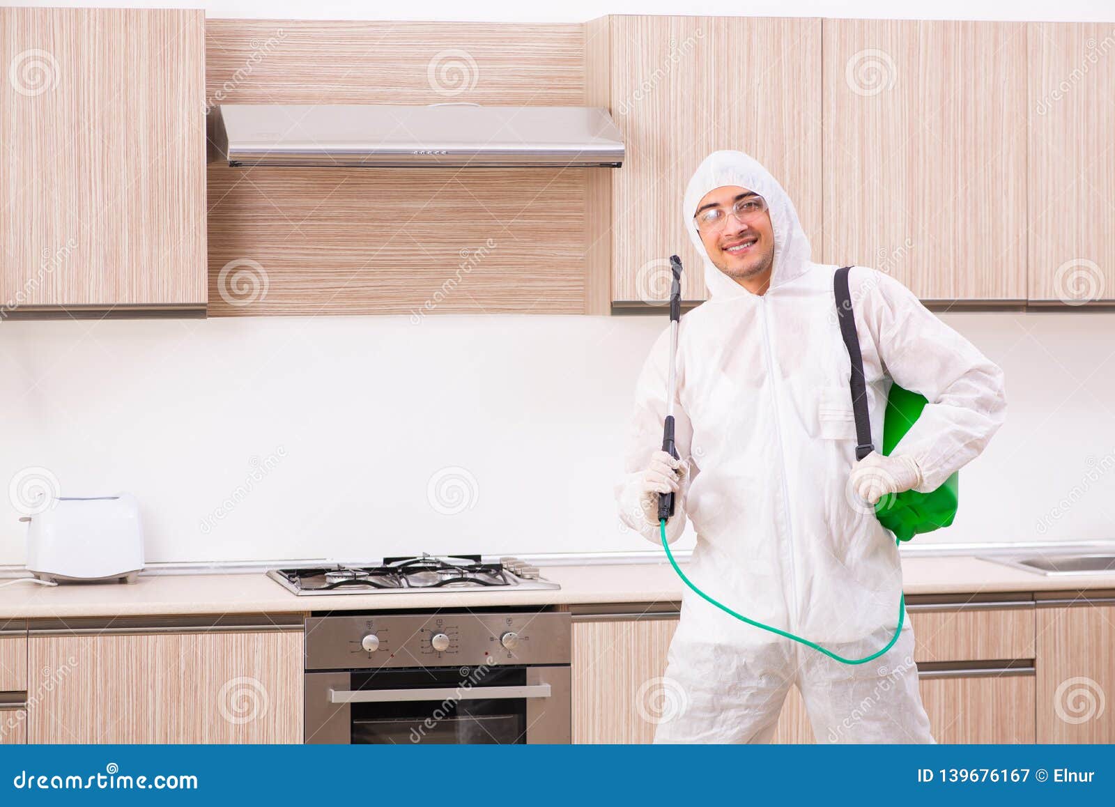 The Professional Contractor Doing Pest Control at Kitchen Stock Image ...
