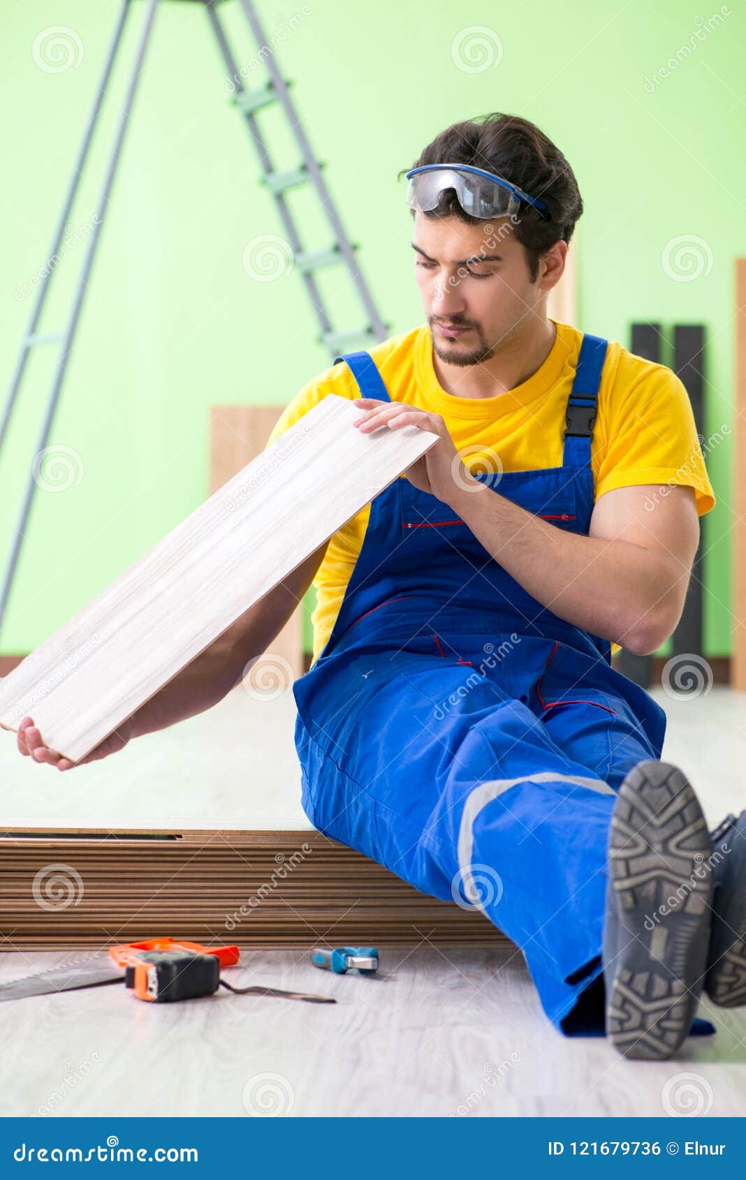 The Professional Contractor Laying Flooring at Home Stock Photo - Image ...