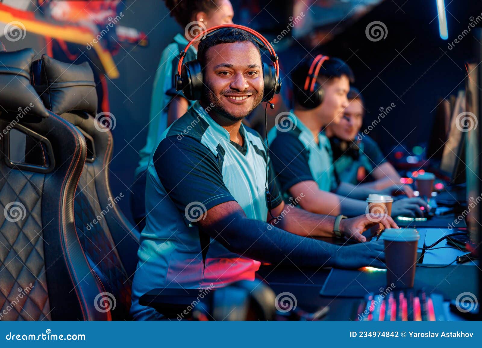 Cheerful Gamer Participates in Team Play in Cyber Club Stock Photo ...