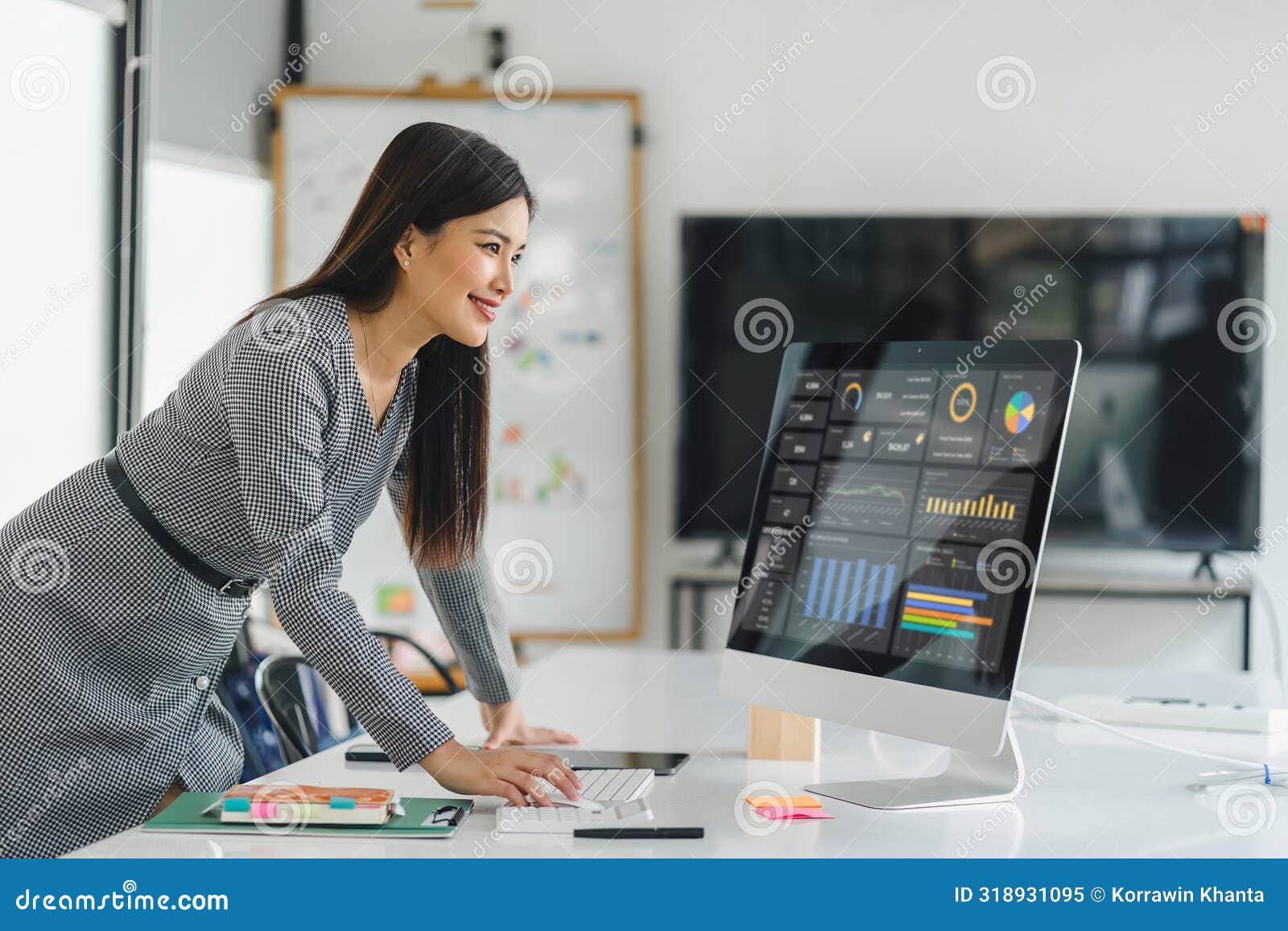 Professional Data Analyst Using Data Visualizations Dashboard on Computer Monitor for Data ...