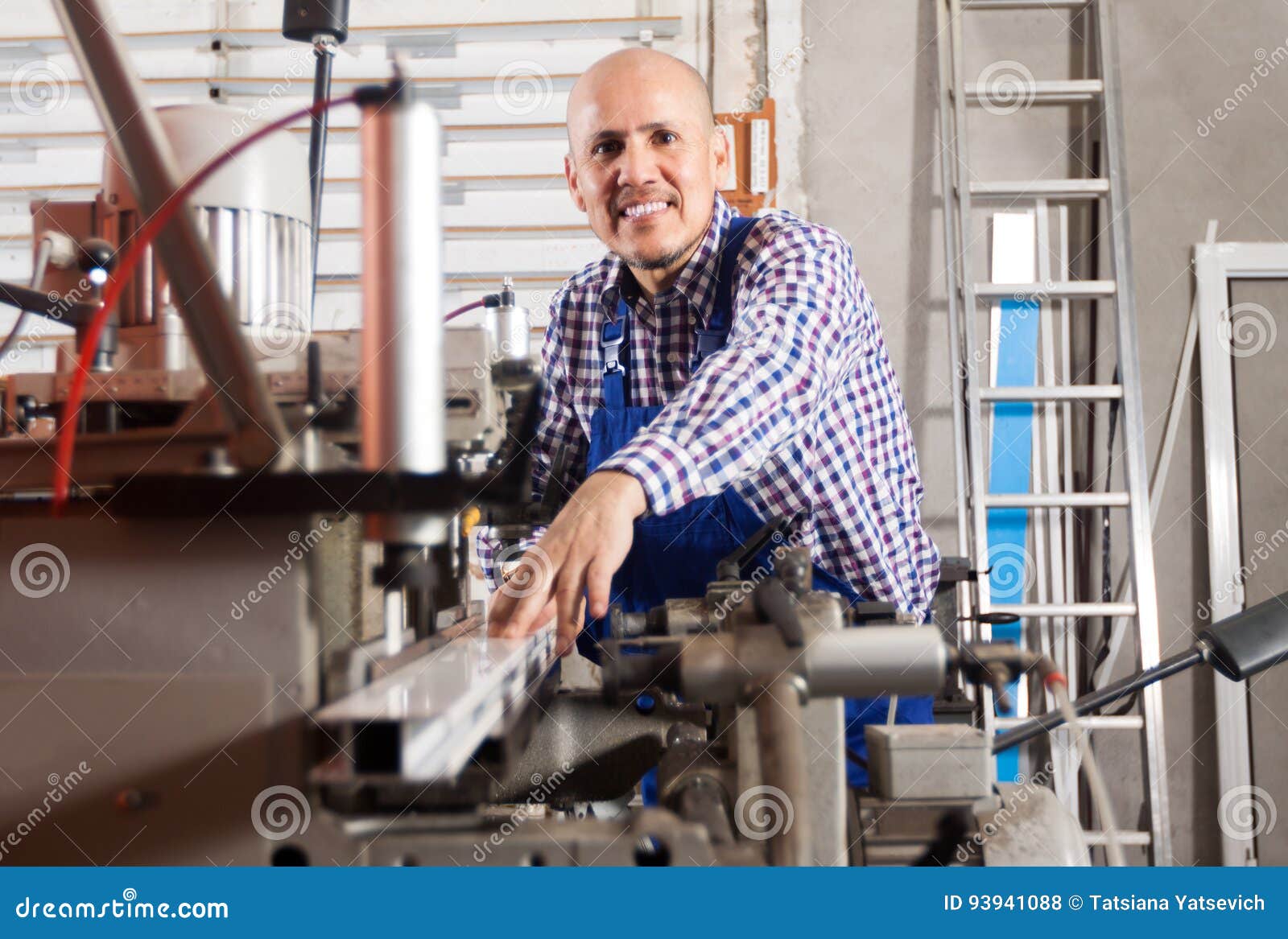 Professional Debonair Worker Toiling on a Machine in PVC Shop Stock ...