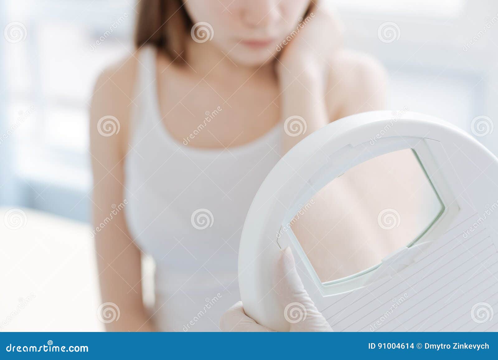 Professional Dermatologist Using Medical Loupe for Skin Examination at ...