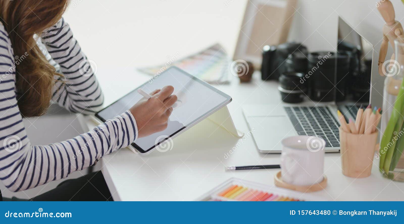 Professional Designer Editing Her Project with Tablet in Modern ...