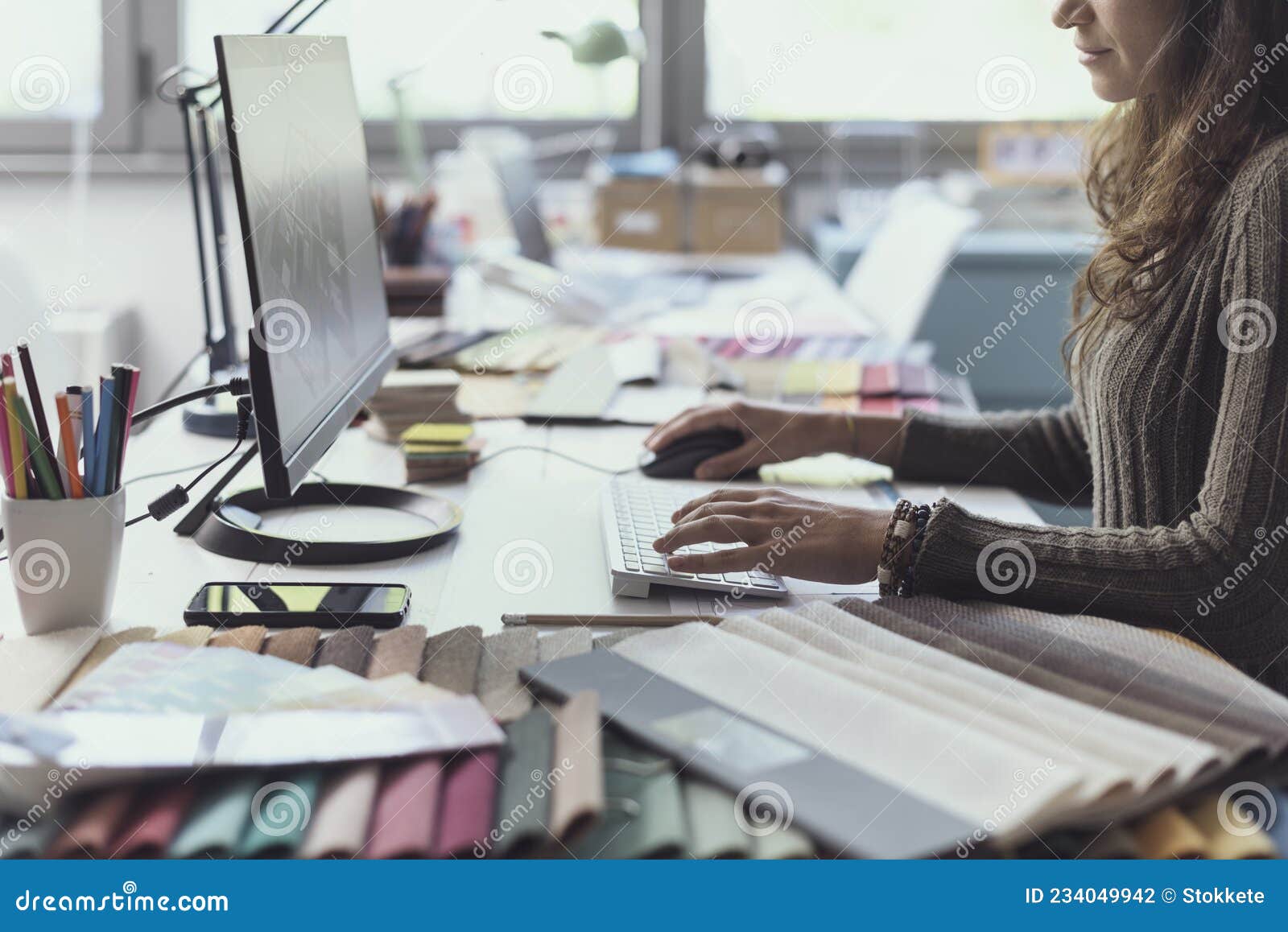 Designer Working with Her Computer in Her Studio Stock Photo - Image of ...