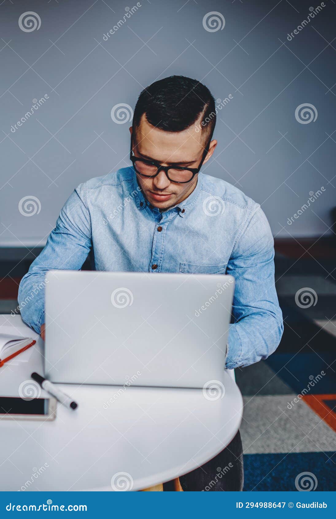 Professional Designers Collaborating on Common Project Sitting at ...