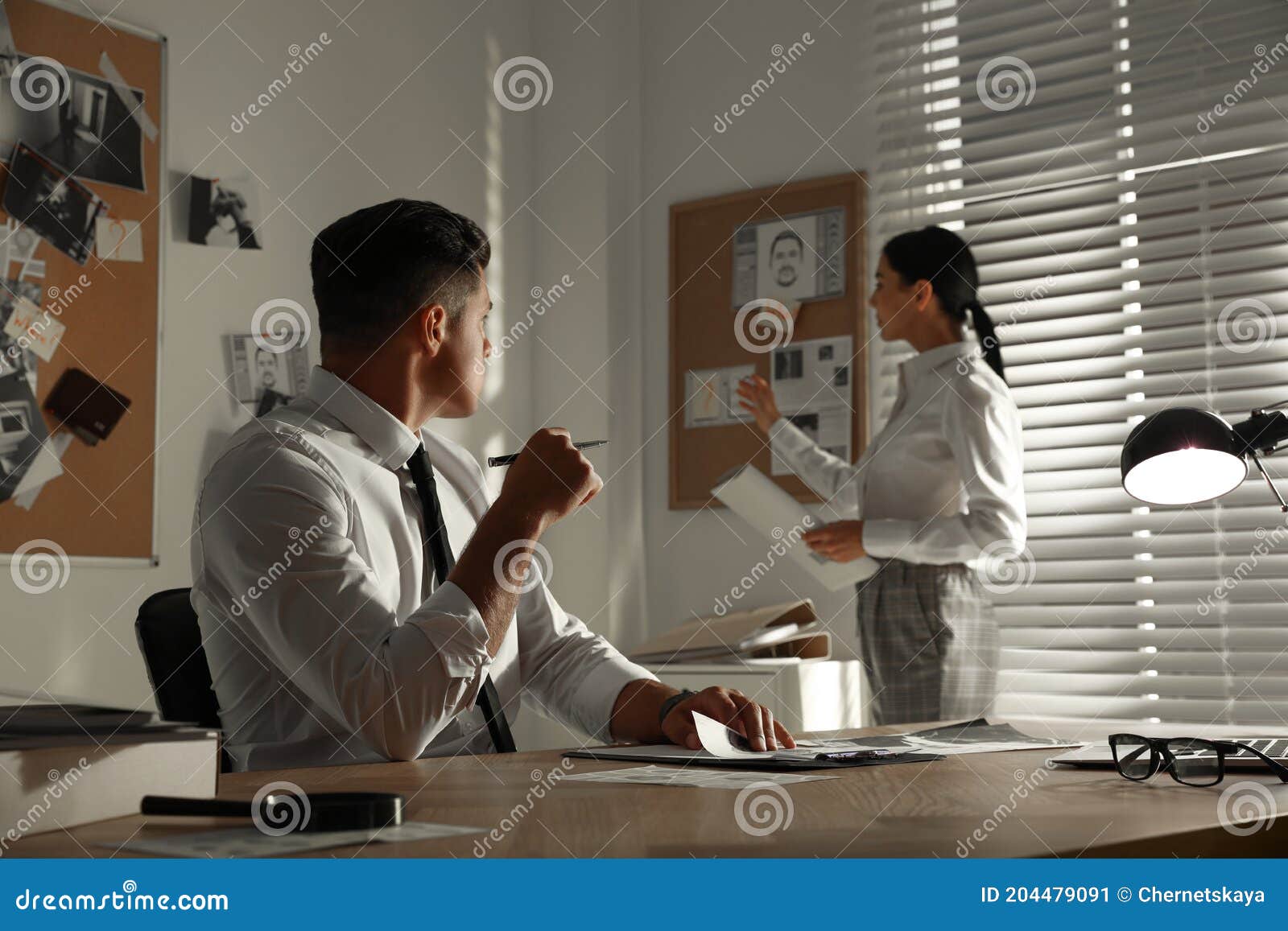 Professional Detectives Working At Desk In Office Stock Photo ...