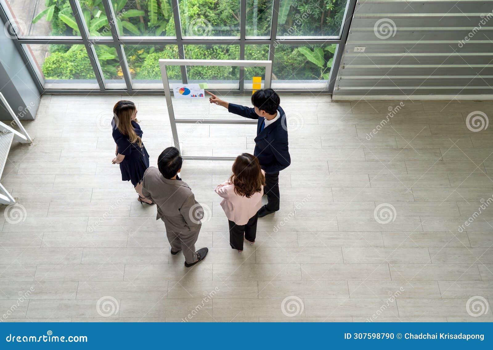 Professional and Diverse Business Team Stand Together, Engaged in a ...