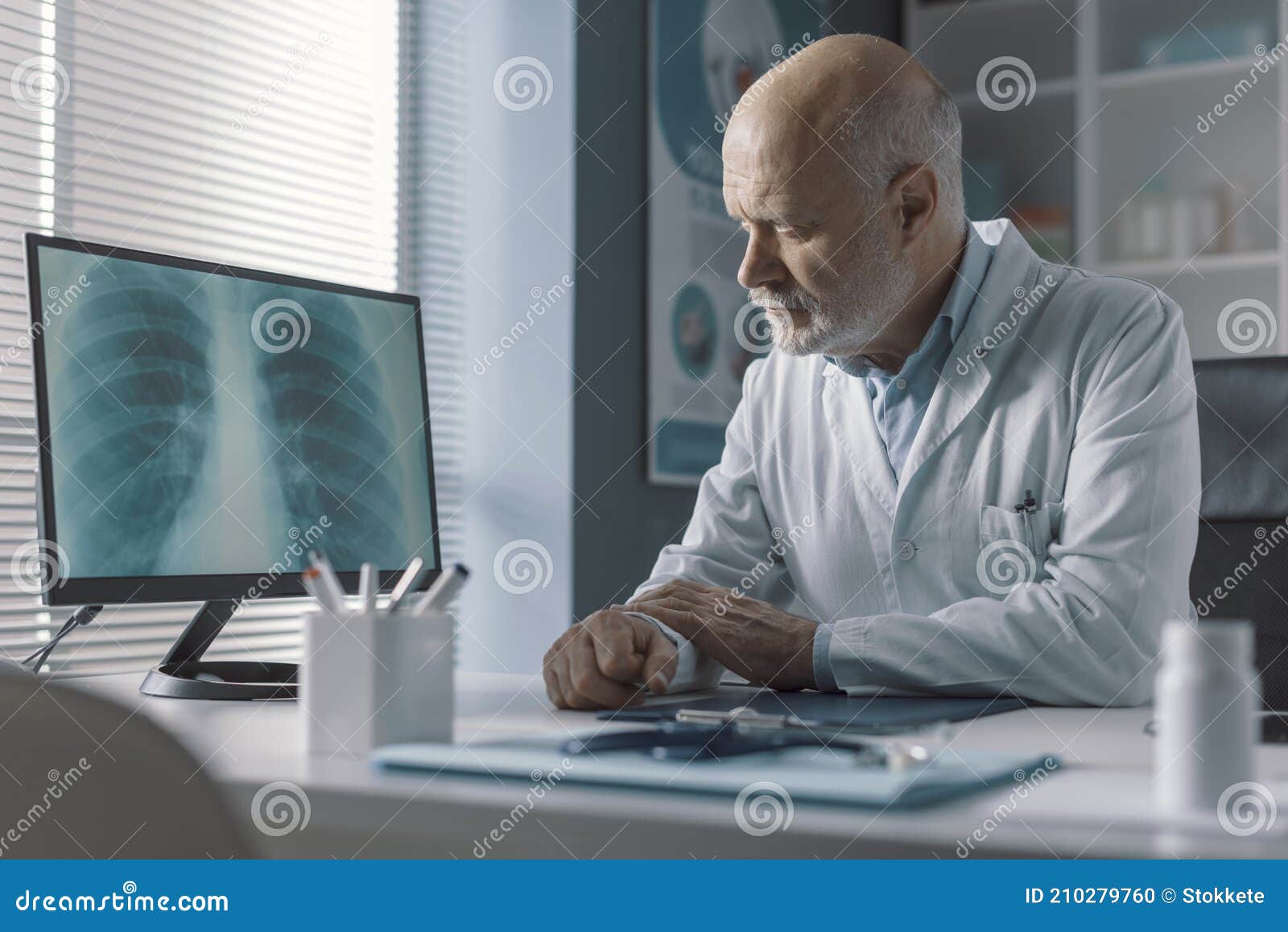 Doctor Analyzing an X-ray Image on the Computer Screen Stock Photo ...