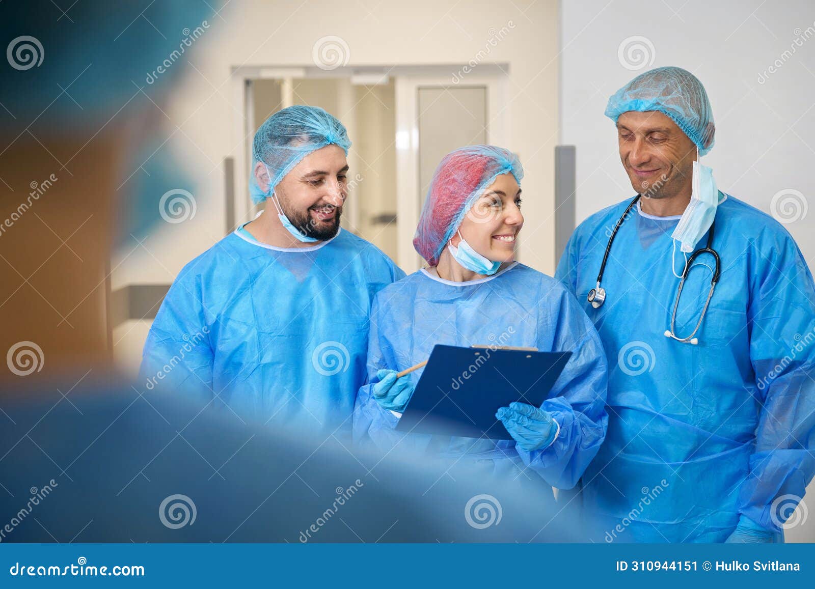 Professional Doctors Communicating while Standing in Hospital Stock ...