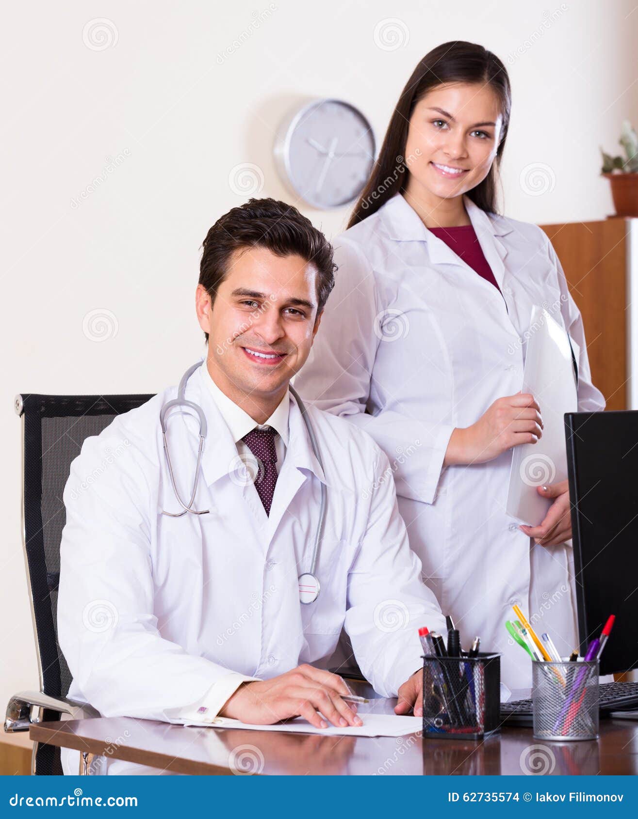Professional Doctors Smiling in Clinic Stock Photo - Image of ...