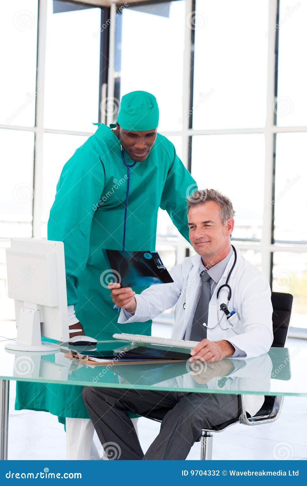 Professional Doctors Studying an X-ray Stock Photo - Image of hospital ...