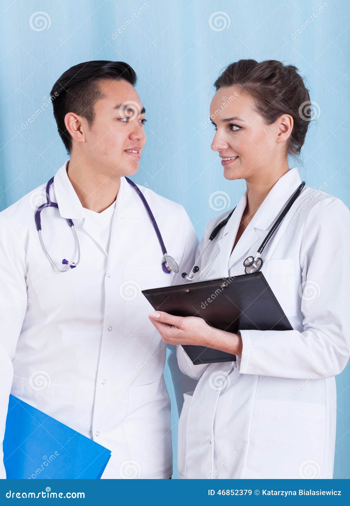 Professional Doctors Talking at Work Stock Image - Image of couple ...
