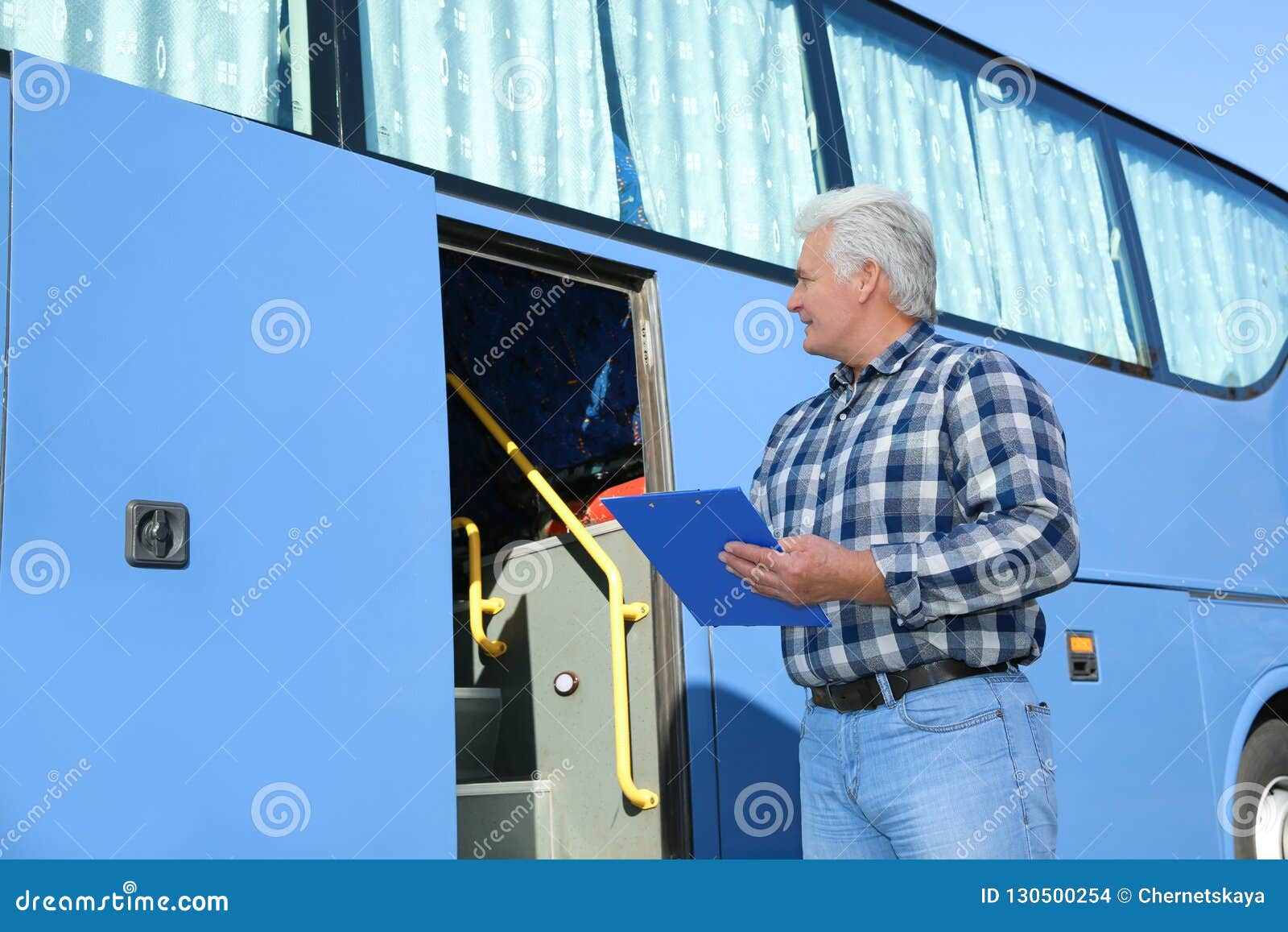 Professional Driver with Clipboard Near Bus. Stock Photo - Image of ...