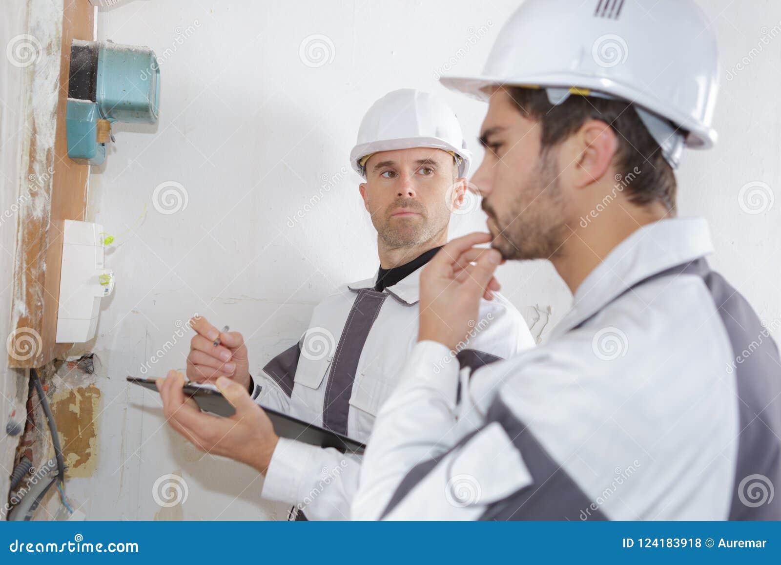 Professional Electrician Installing Components in Electrical Shield ...