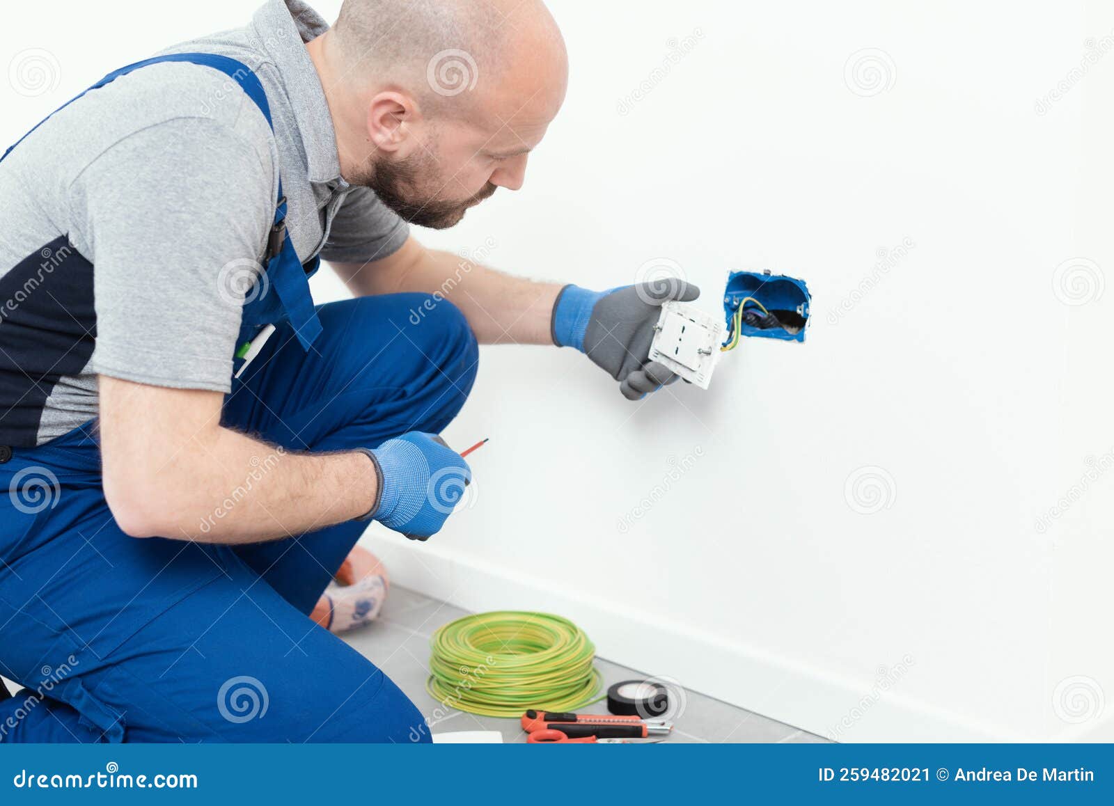 Professional Electrician Installing a Wall Socket Stock Image - Image ...