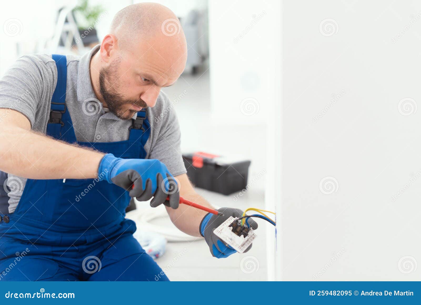 Professional Electrician Installing a Wall Socket Stock Image - Image ...