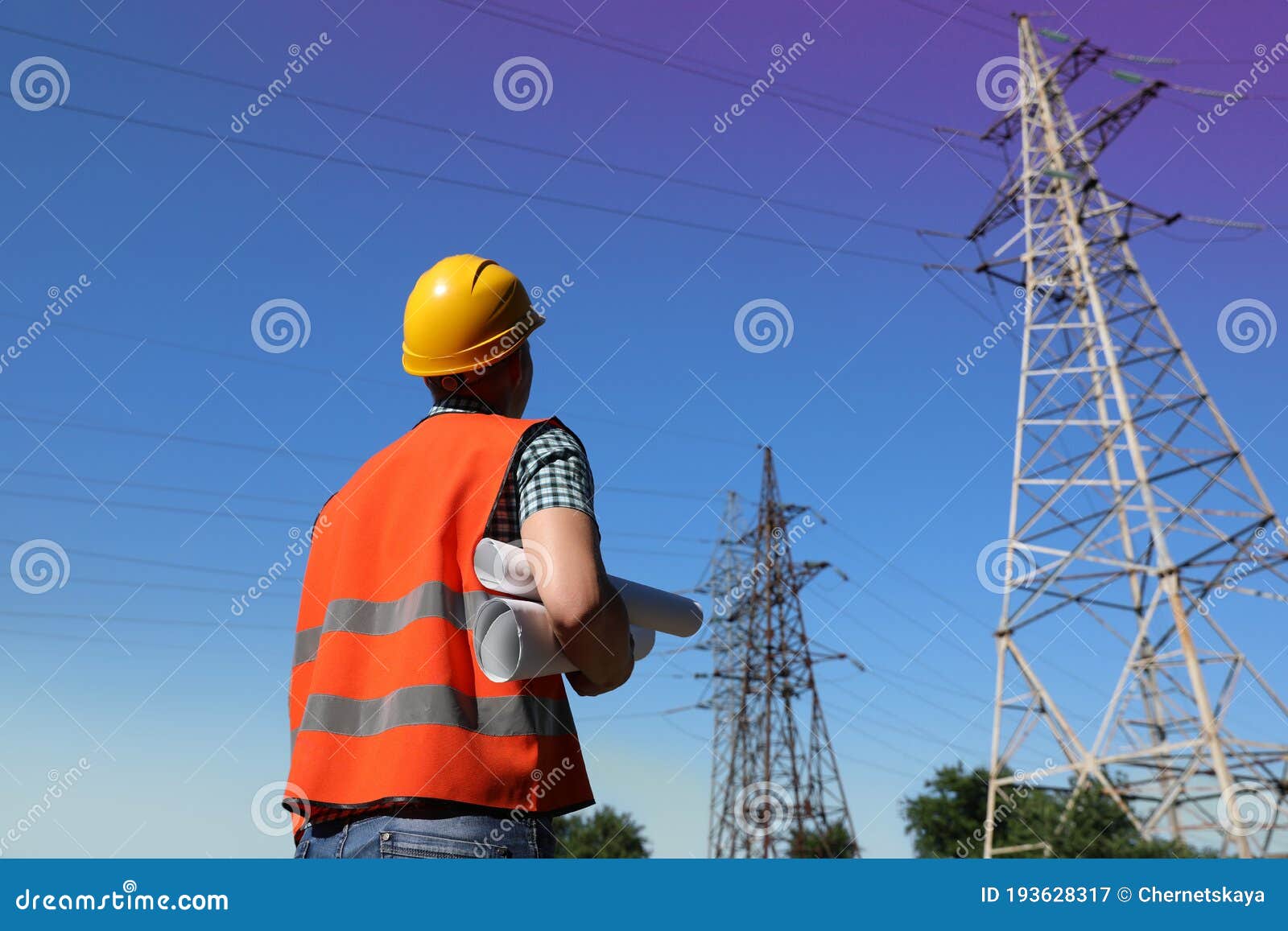 Electrician with Papers Near High Voltage Tower Stock Image - Image of ...