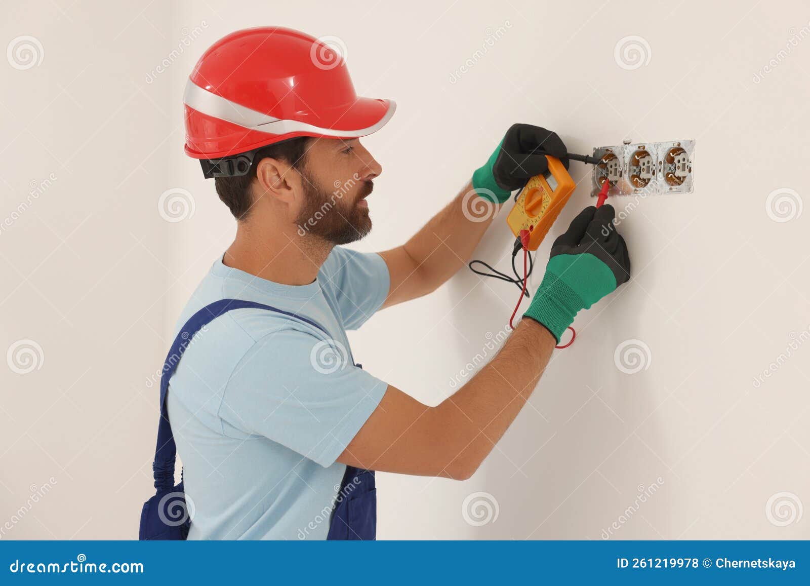 Professional Electrician with Tester Checking Voltage Indoors Stock ...